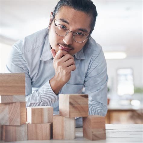 Premium Photo Building Blocks Business Man With Plan And Vision