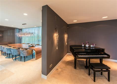 Corian Facade Wraps Around Waterside Dutch Home