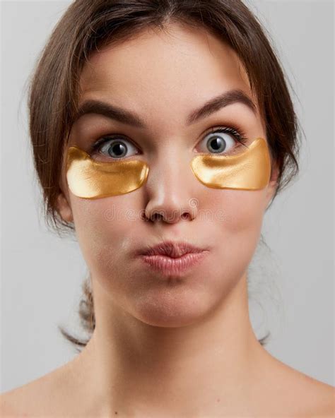 Grimace Close Up Beauty Portrait Of Happy Beautiful Woman Applying Face Cosmetics Products And