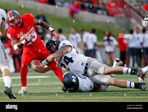 New Mexico Running Back Tyrone Owens 25 Is Stopped By Utah State