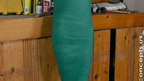 Spunky Blonde Jana Jordan Stands Tightly Wrapped Against The Wall Of A