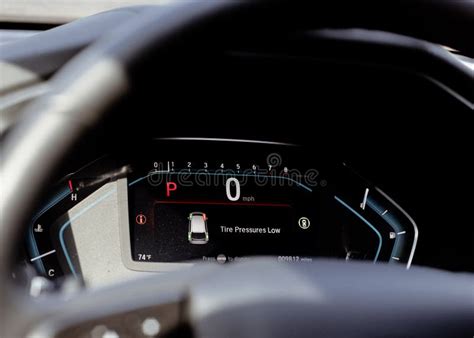 Side View Tire Pressure Low Indicator Displays On Instrument Panel Of