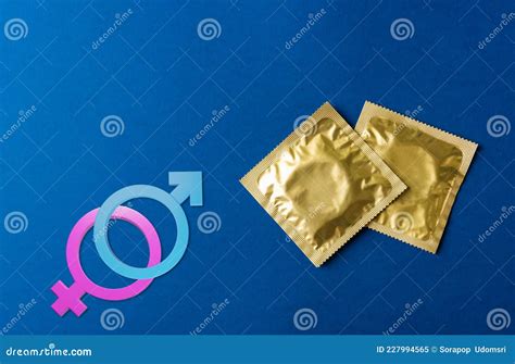 Condom In Wrapper Pack And Male Female Gender Signs Stock Image