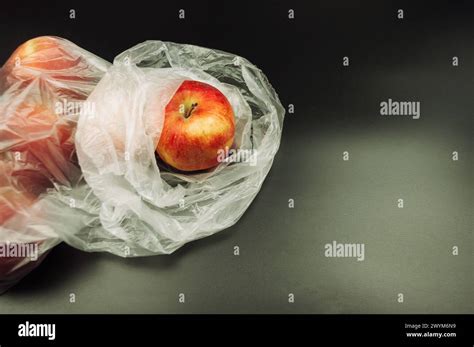 Fresh Apples Encased In Non Recyclable Plastic Highlight The
