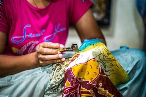 Premium Photo Midsection Of Woman Making Design On Textile