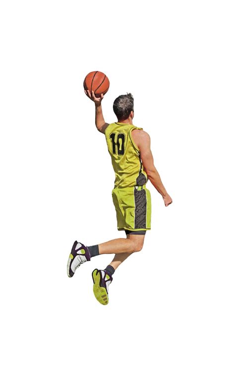 Premium Photo Basketball Player With A Yellow Uniform Shooting On White Background