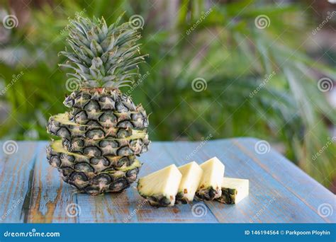 Fresh Pineapple Slices On Blue Wood Texture Royalty Free Stock Image