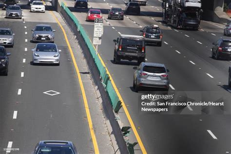 Cars Drive In The Carpool Lane On Westbound And Eastbound Interstate