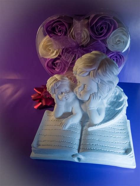 Two Angels Read A Book Behind Their Backs Composition Of Roses Heart
