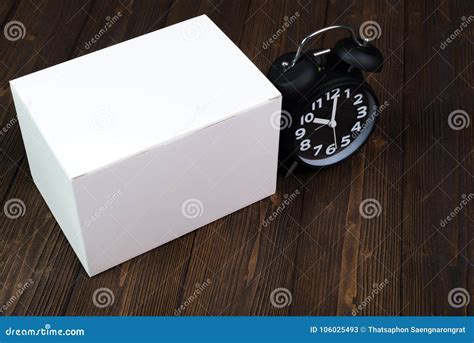 Vintage Black Alarm Clock With White Packaging T Box On Dark Stock