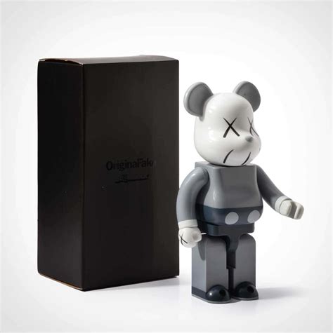 Download Kaws Bearbrick Figurewith Box Wallpaper
