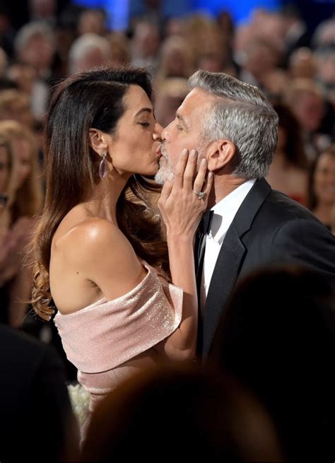 George Clooney And His Wife Share The Sexiest Smooch Before Gushing