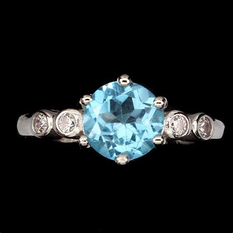 Пръстен с Швейцарско син топаз и цирконий