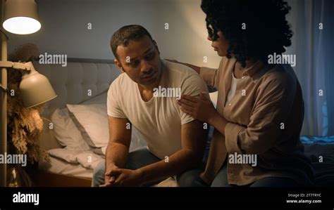 African American Sad Man Sit On Bed Night Evening At Home Suffer