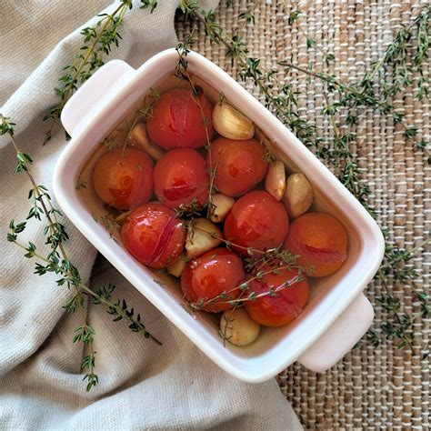 Confit Tomatoes And Garlic Cooking With Bry