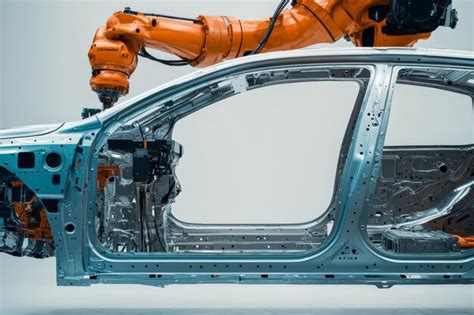 Robotic Arm Assembling Car Chassis Premium Ai Generated Image