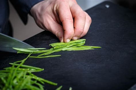Premium Photo Chef Cutting Chives