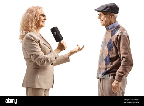 Female Journalist Interviewing An Elderly Man Isolated On White
