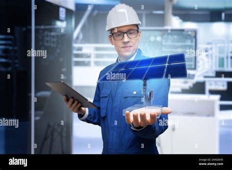 Development Engineer Holds In His Hands A Model Of A Solar Panel