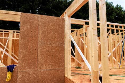 Construction Workers Build New House Using Wooden Frames Boards In
