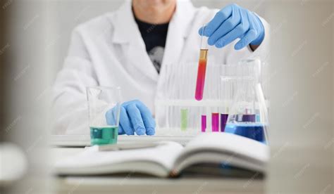 Premium Photo A Male Chemist Holds Test Tube Of Glass In His Hand