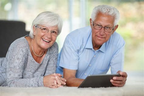 Elderly Couple Tablet And Portrait In Home For Relax Online Banking And Memory App Senior