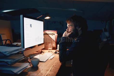 It Takes A Keen Eye To Be A Coder A Young Computer Programmer Working Late In The Office Stock