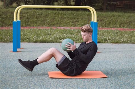 Premium Photo Athlete Sits On Their Butt With Their Back And Legs