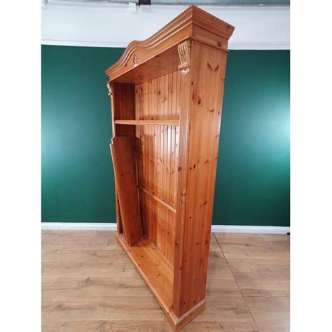 A Modern Pine Open Bookcase With Arched Top Fitted Adjustable Shelves