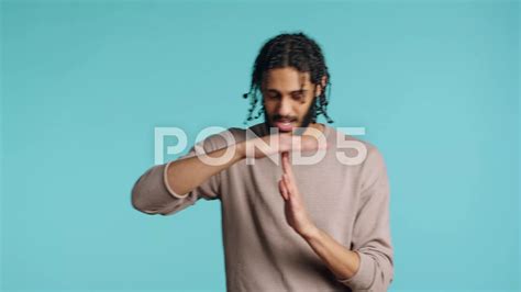 Assertive Man Asking For Timeout Doing Hand Gestures Studio