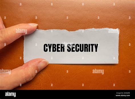 Cyber Security Message Written On Ripped Paper Piece With Brown