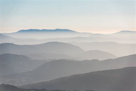 Download Calm Foggy Mountains Wallpaper