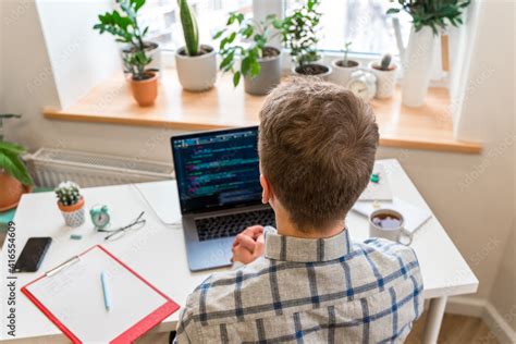 closeup coding on screen man s hands coding and programming on screen