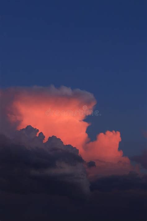 Clouds Painted Pink Against A Dark Sky Stock Image Image Of Sunset