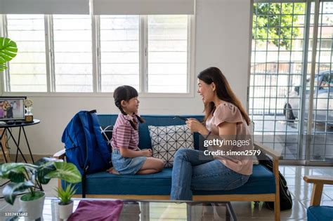 Mother Accompanies Her Daughter On First Day Of School High Res Stock