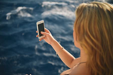 Royalty Free Photo Woman Holding Smartphone With Portrait Wallpaper