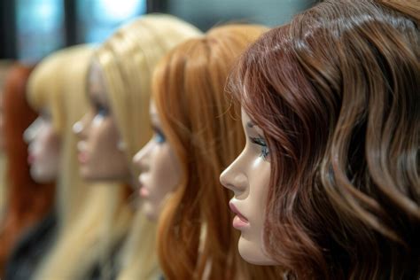 Premium Ai Image A Photo Showing A Straight Row Of Mannequin Heads