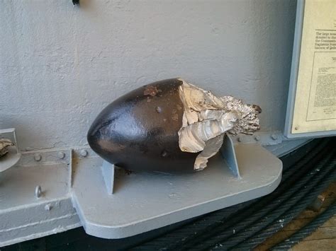 Armor Piercing Shell From A 17 Pdr Gun Embedded In A Section Of Armor From A Tiger I Tank