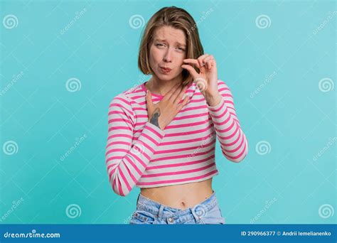 Woman Showing A Little Bit Gesture With Sceptic Smile Showing Minimum Sign Measuring Small Size