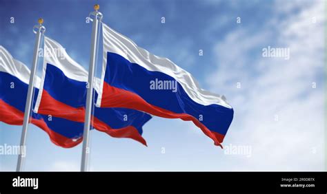Three National Flags Of Russia Waving In The Wind On A Clear Day White