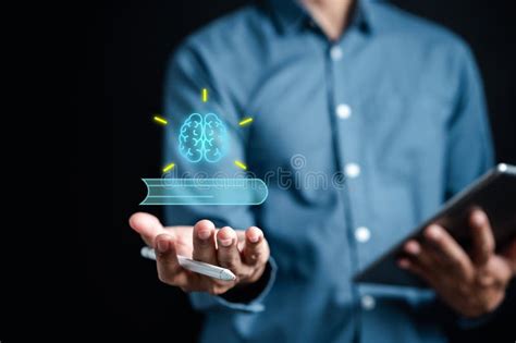 Man Hand Holding Virtual Light Bulb Brain And Book With Learning