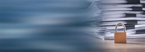 Files And Documents With A Padlock On The Wooden Table Data Security