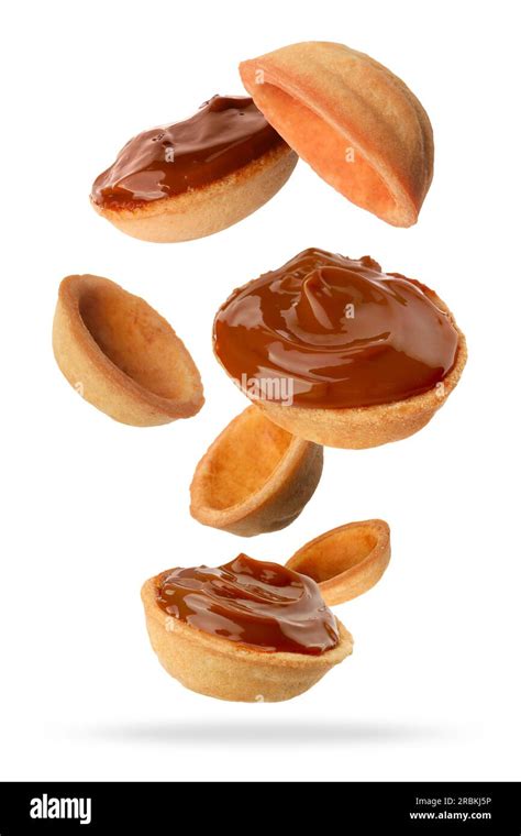 Many Empty And Filled With Caramelized Condensed Milk Nut Shell Shaped