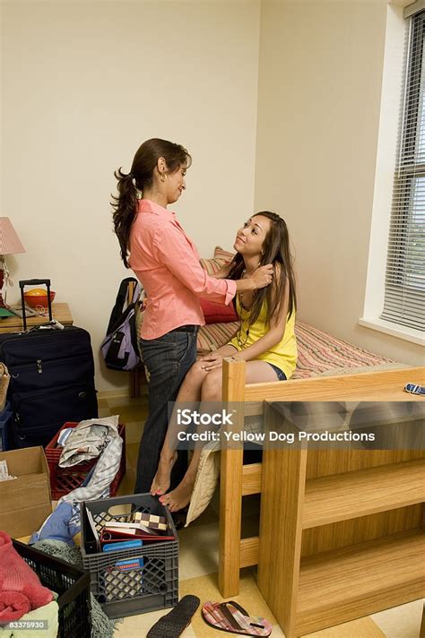 Mom Comforting Daughter In Her College Dorm Room Zdjęcia Stockowe I