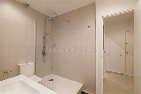 Spacious Walk In Shower In Modern Bathroom With Glass Partition And