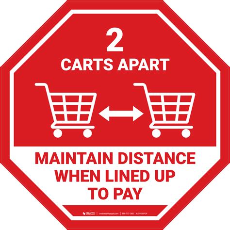 2 Carts Apart When Lined Up To Pay With Icon Stop Floor Sign