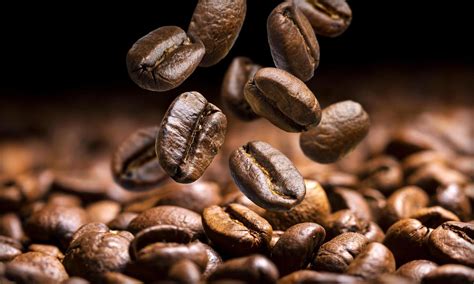 Falling Coffee Beans Close Up Flying Coffee Beans Over Dark Background
