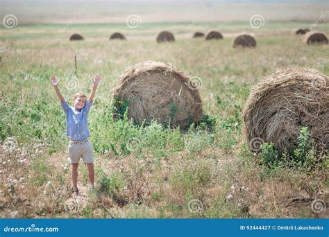 Attractive Boy Sitting On A Haystack And Smiling Stock Image Image Of Round Freedom