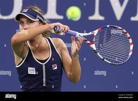 Sofia Kenin In Action Against Ons Jabeur During A Womens Singles Match