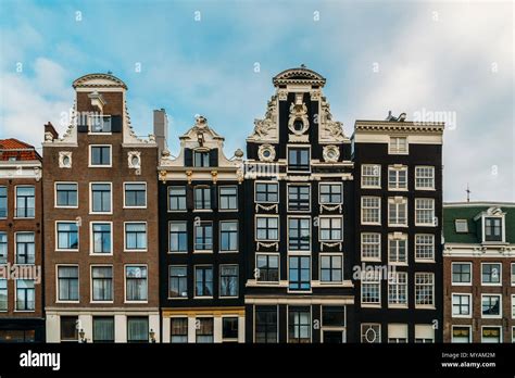 Beautiful Architecture Of Dutch Houses On Amsterdam Canal In Autumn